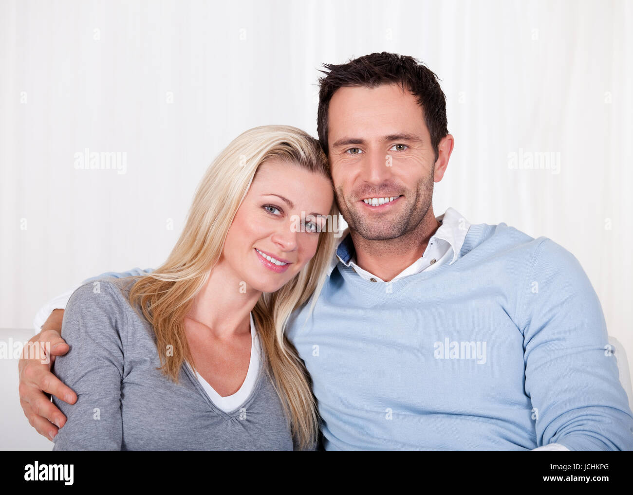 Couple mans arm around shoulder hi-res stock photography and images - Alamy
