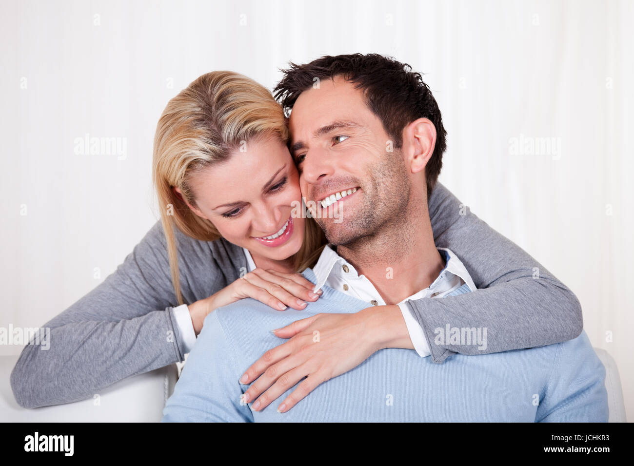 Woman arm around mans shoulder hi-res stock photography and images - Alamy