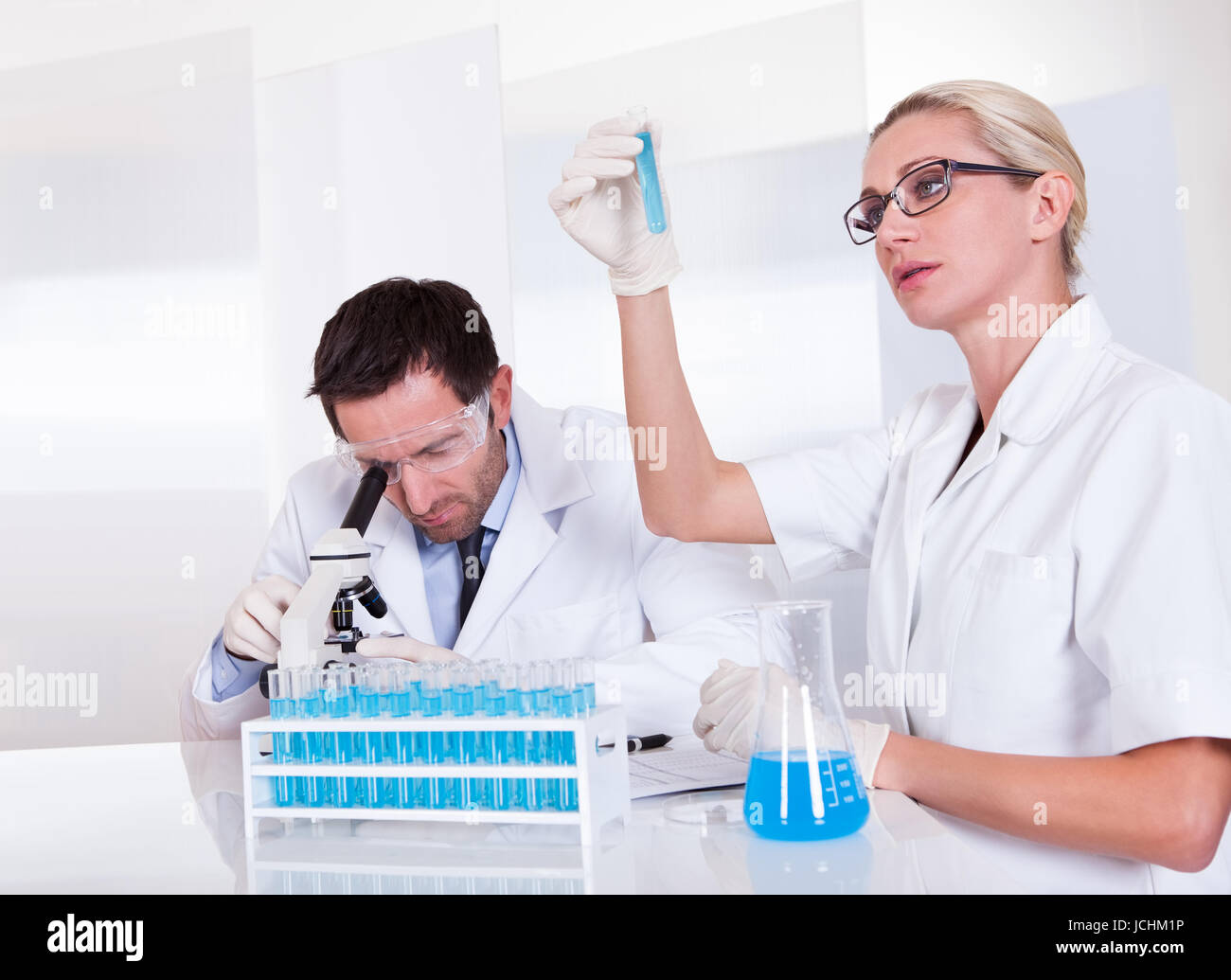 Two lab technicians at work in a laboratory Stock Photo - Alamy