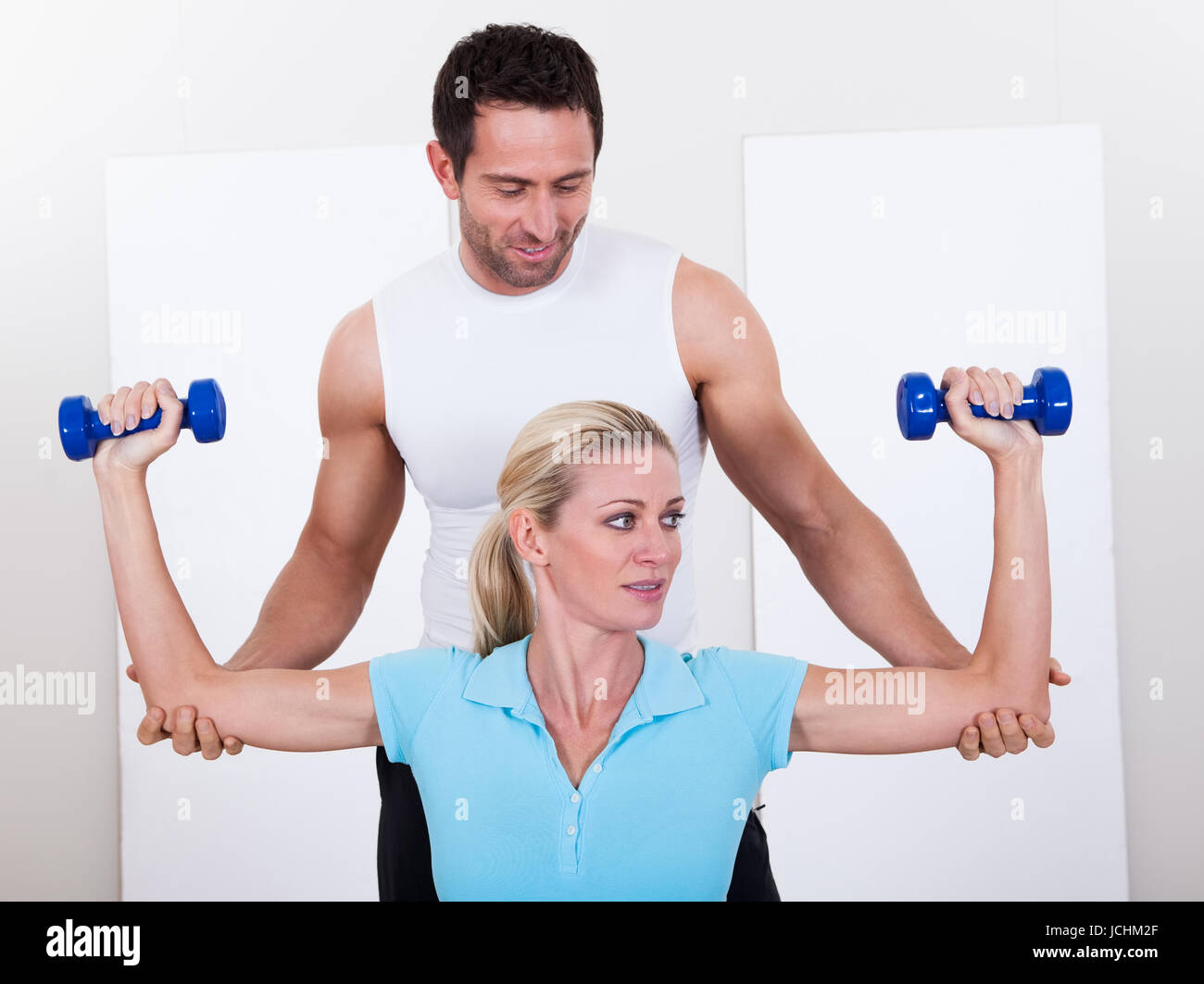 Man lifting arm guiding woman hi-res stock photography and images - Alamy