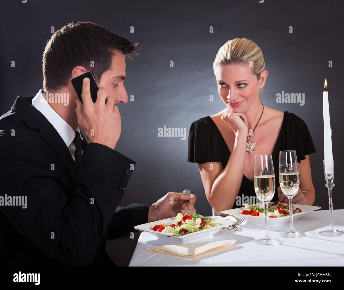 Phone call during dinner hi-res stock photography and images - Alamy
