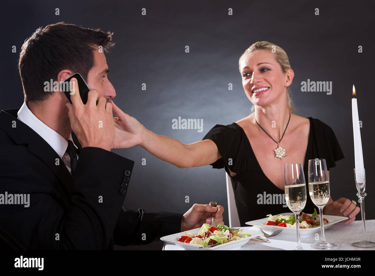 Phone call during dinner hi-res stock photography and images - Alamy