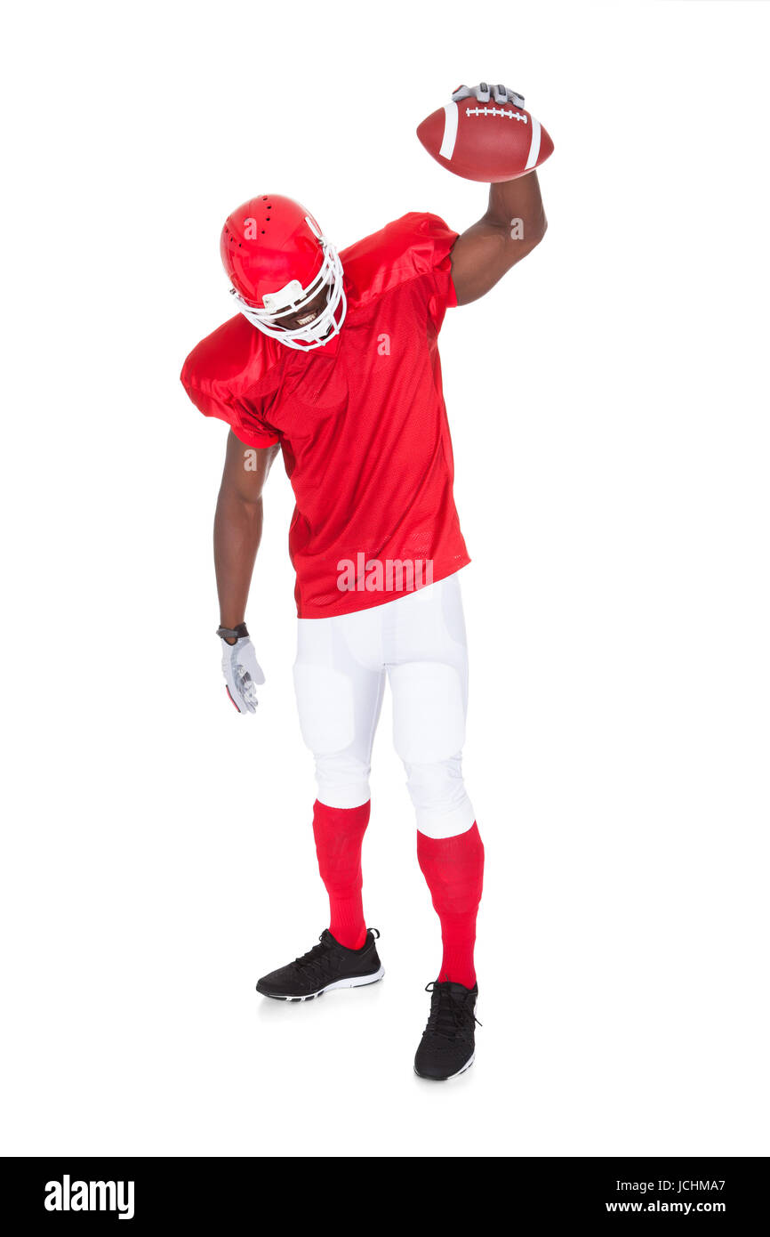 Portrait Of Frustrated American Football Player With Rugby Ball Over ...