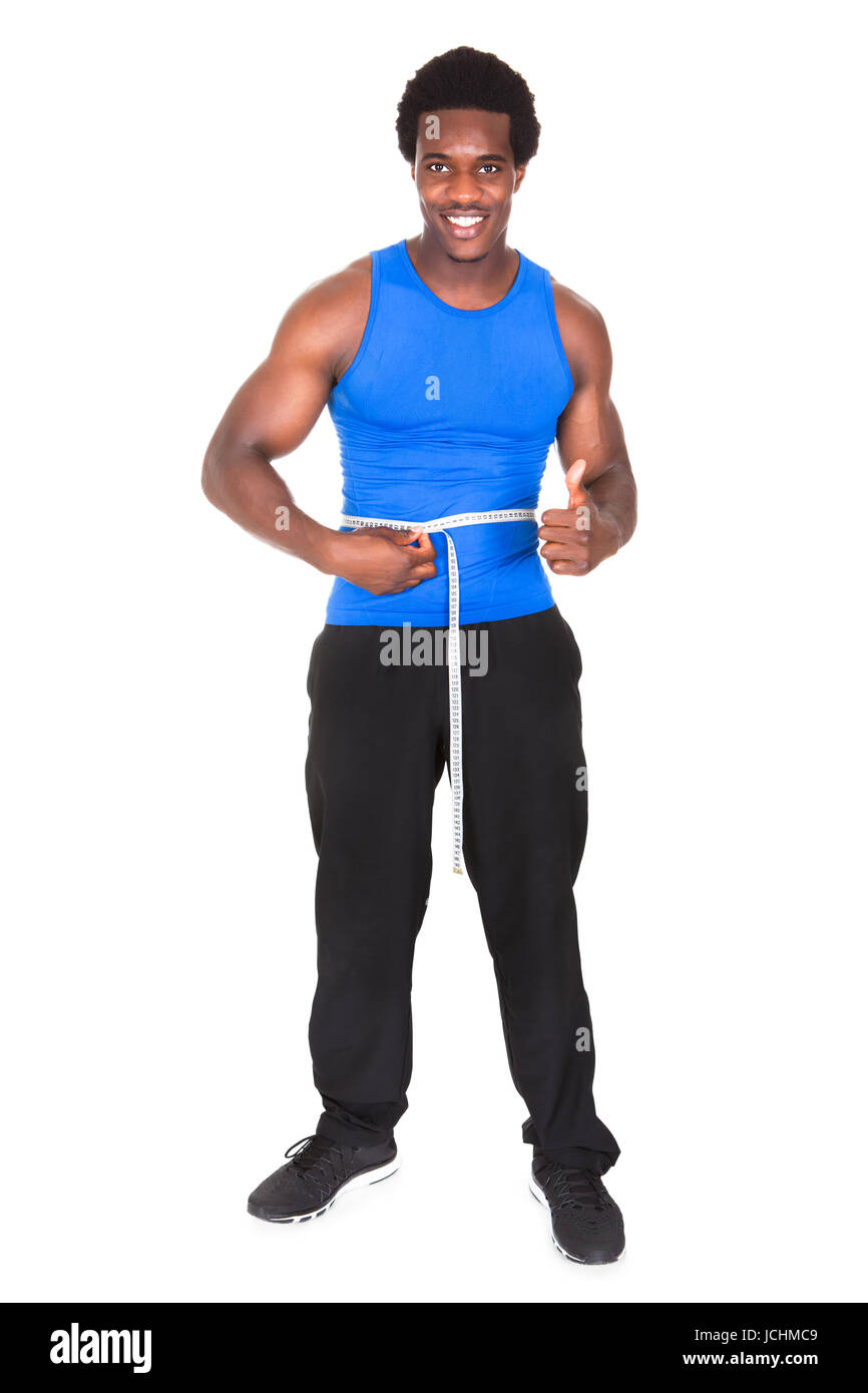 Happy Bodybuilder Measuring His Waist Showing Thumb Up Sign Stock Photo ...