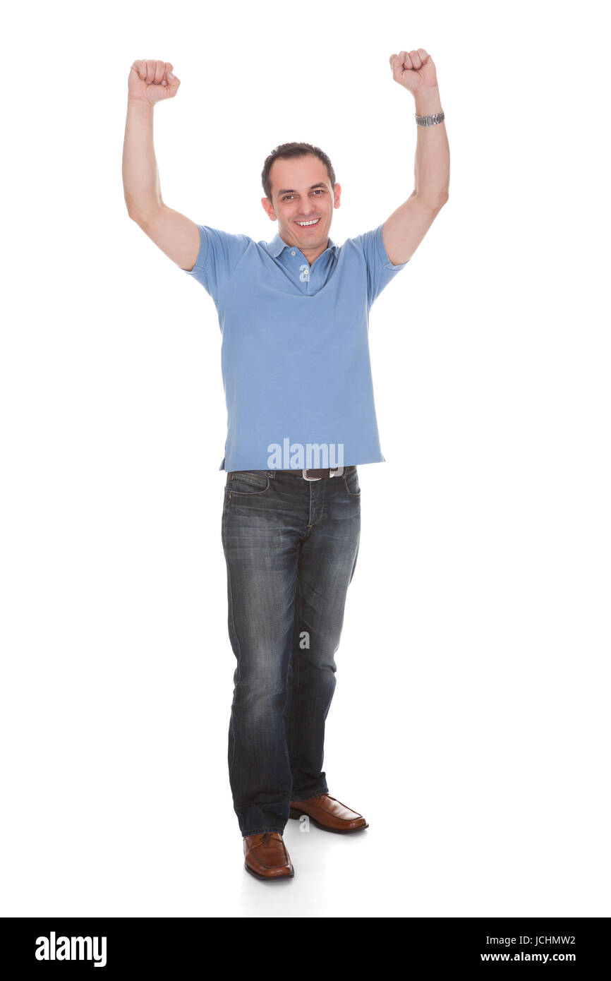 Happy Man With Arm Raised Over White Background Stock Photo - Alamy