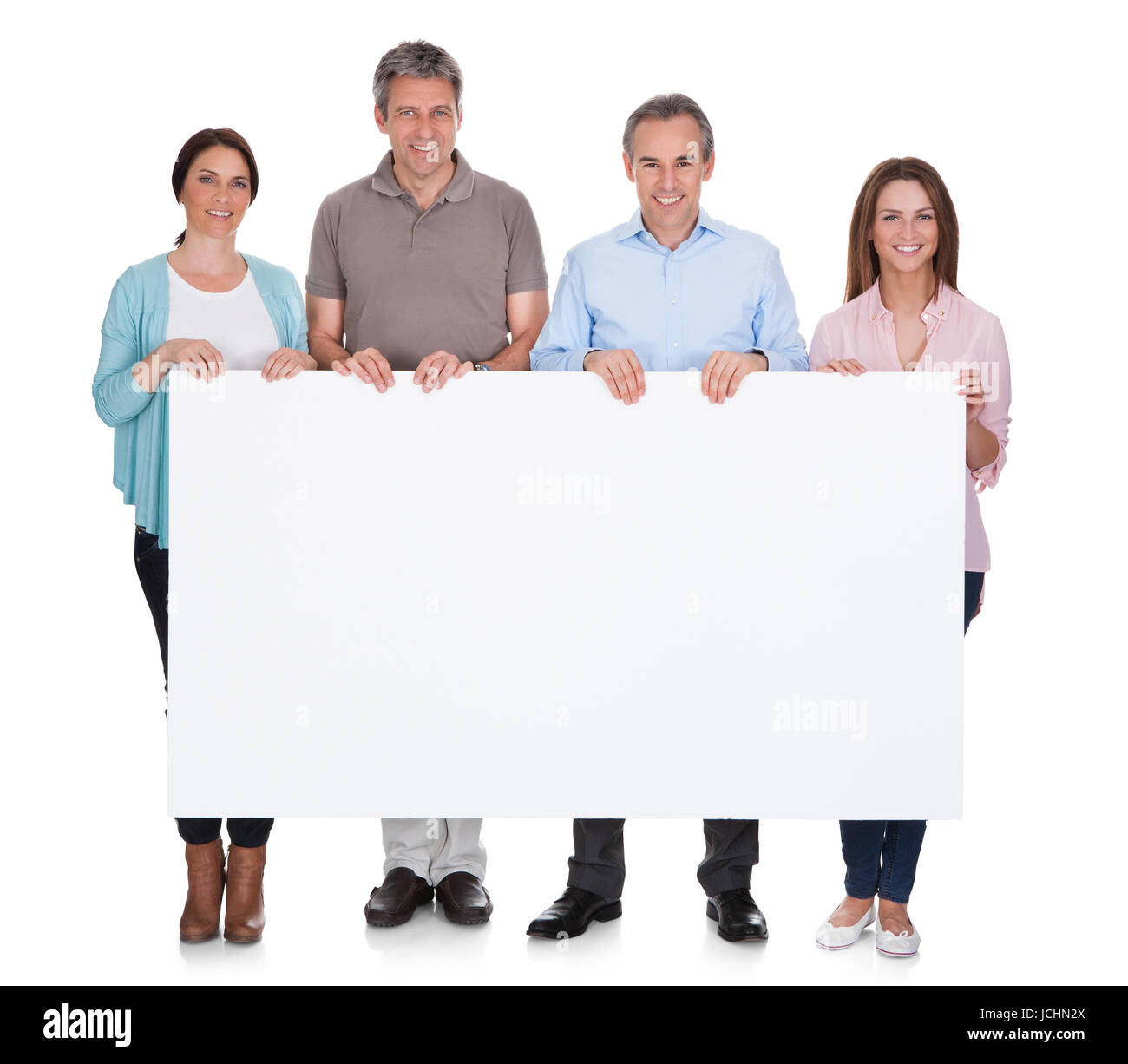 Group Of Happy People Holding Placard Over White Background Stock Photo ...