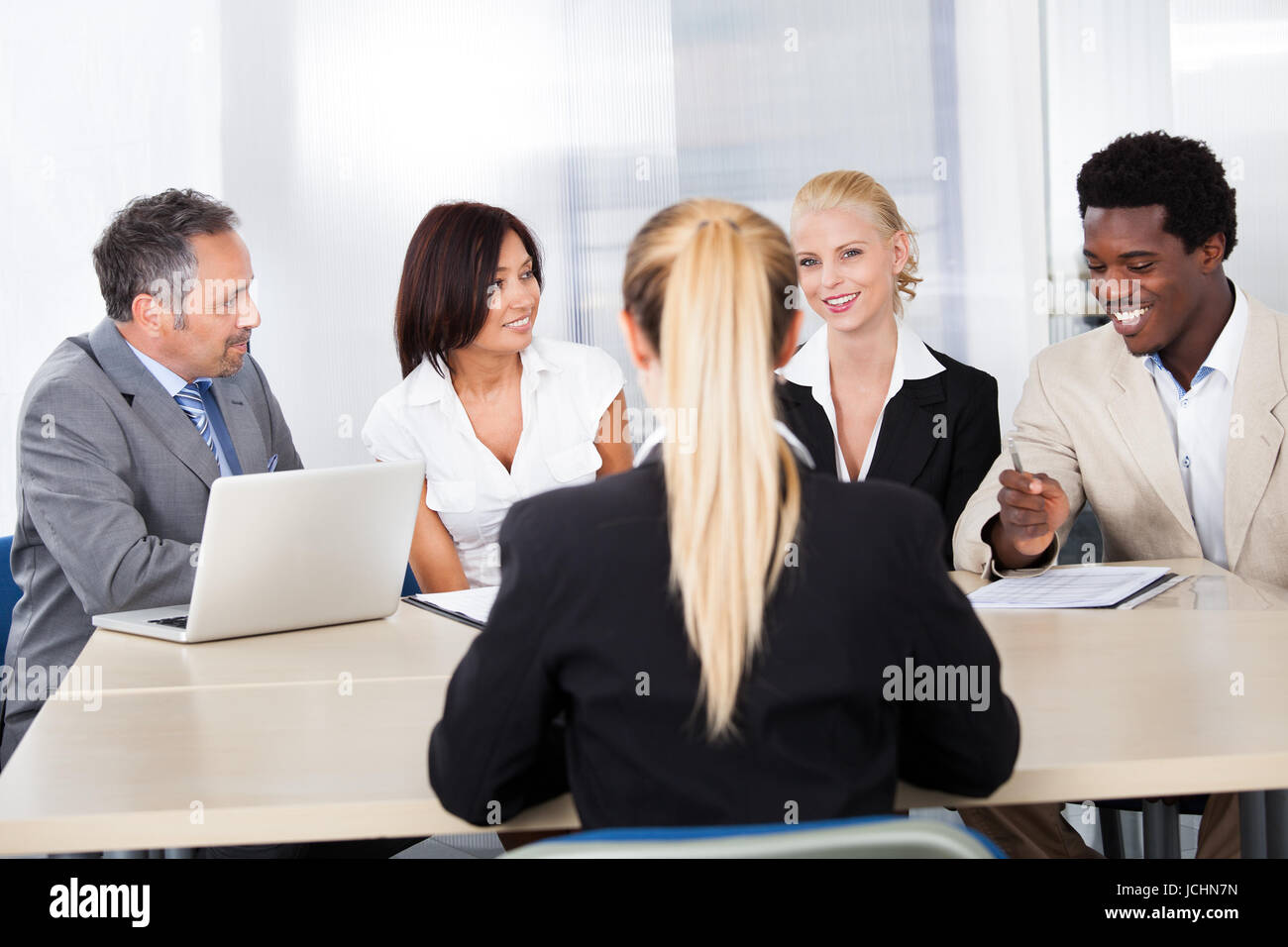 Portrait Of Female Woman Sitting At Interview Stock Photo - Alamy
