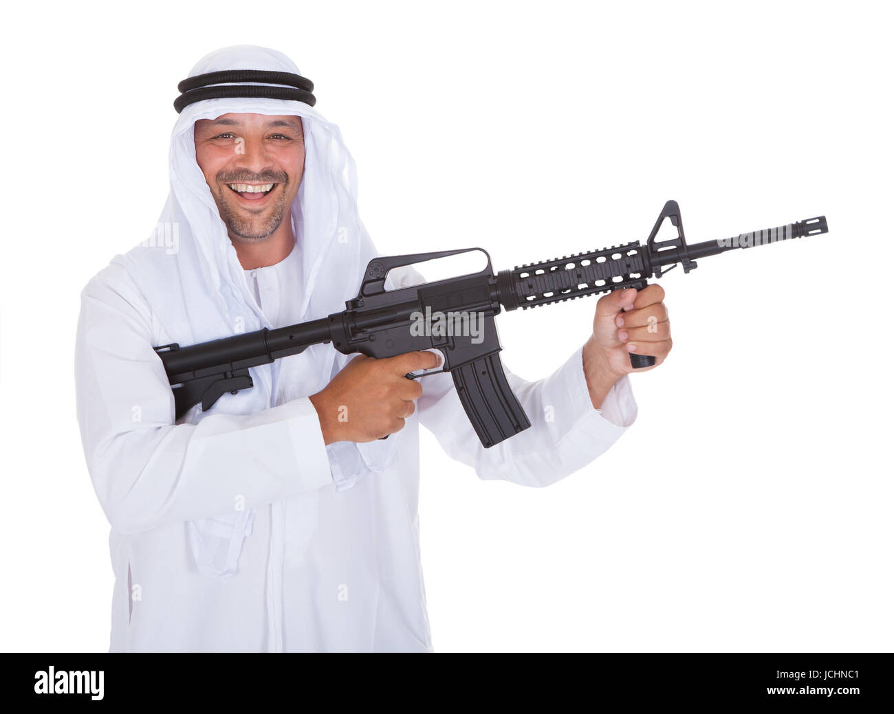Happy Mature Islamic Man Holding Gun Over White Background Stock Photo ...