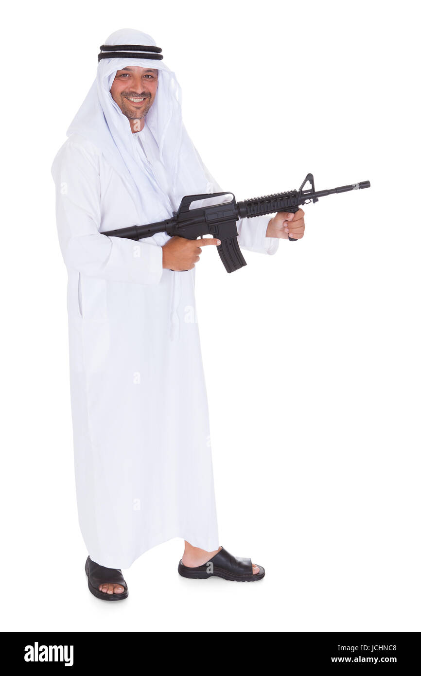 Happy Mature Islamic Man Holding Gun Over White Background Stock Photo ...