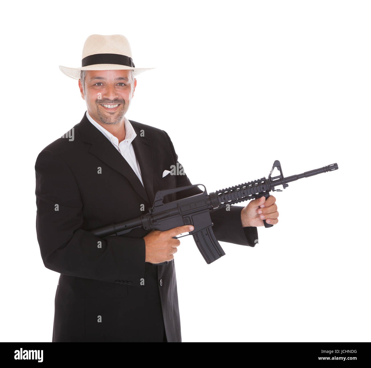 Happy Mature Business Man Holding Gun Over White Background Stock Photo ...