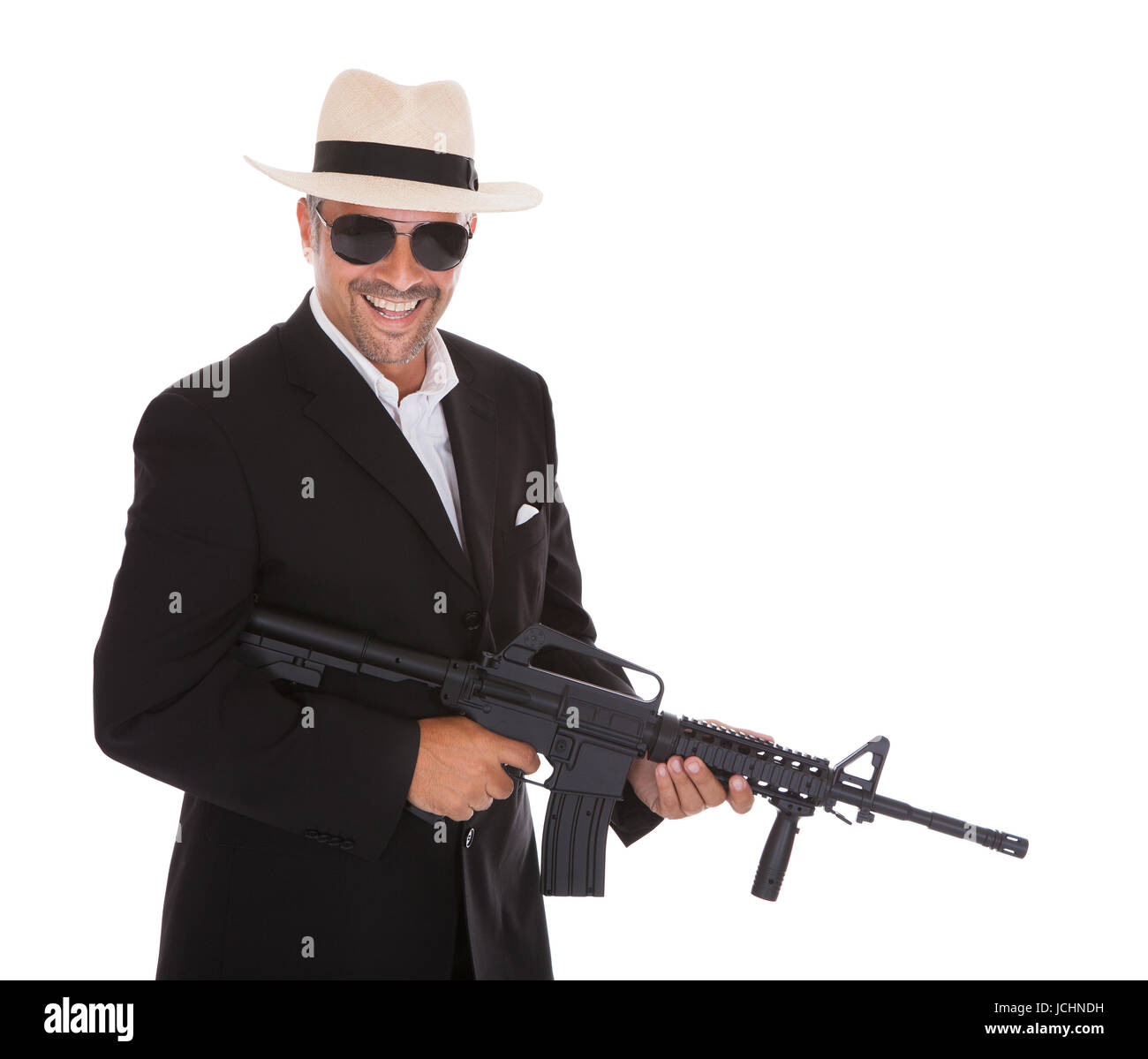 Happy Mature Business Man Holding Gun Over White Background Stock Photo ...