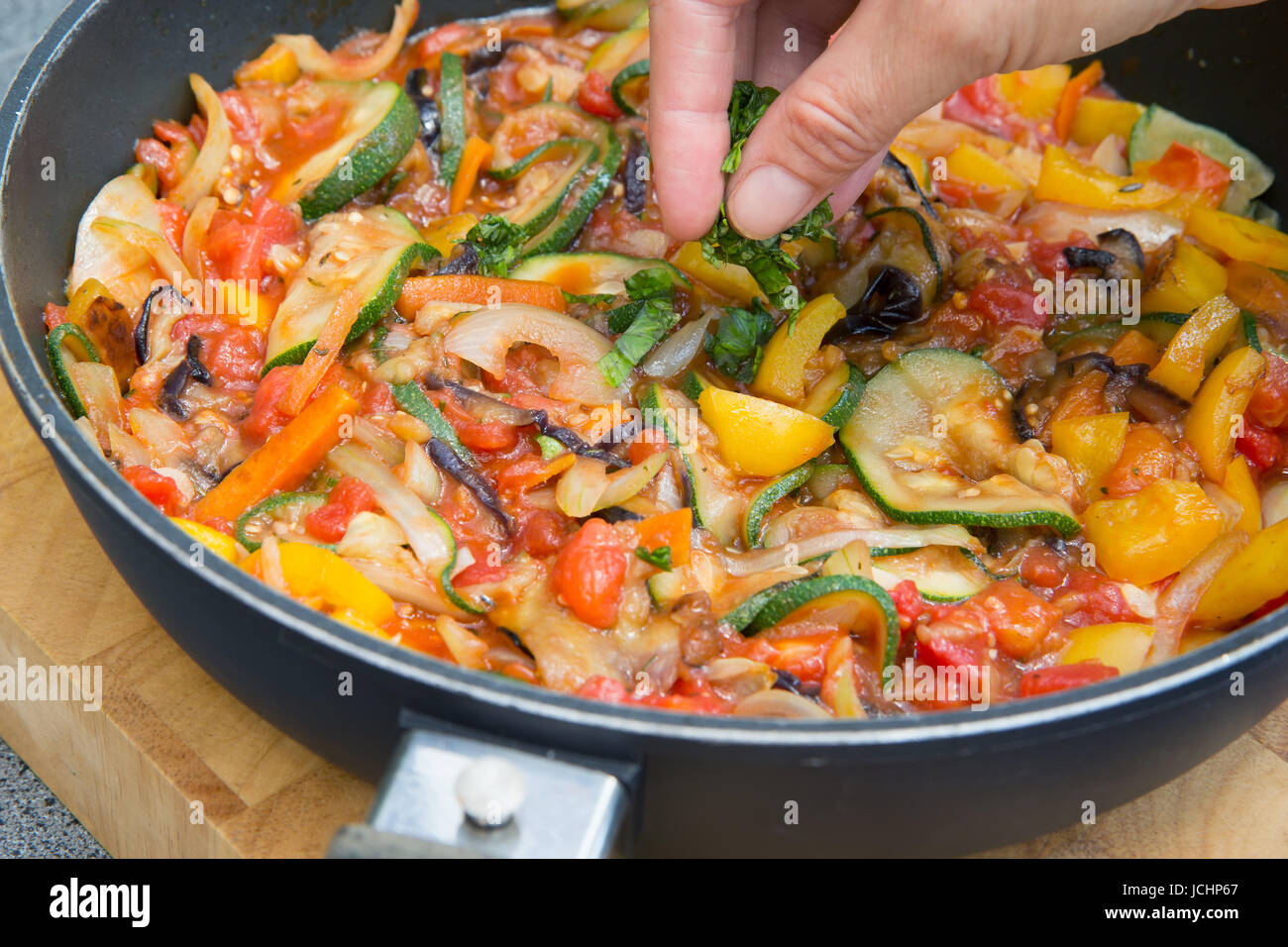 Cooking the typical Provencal meal - Ratatouille. Typical Provencal ...