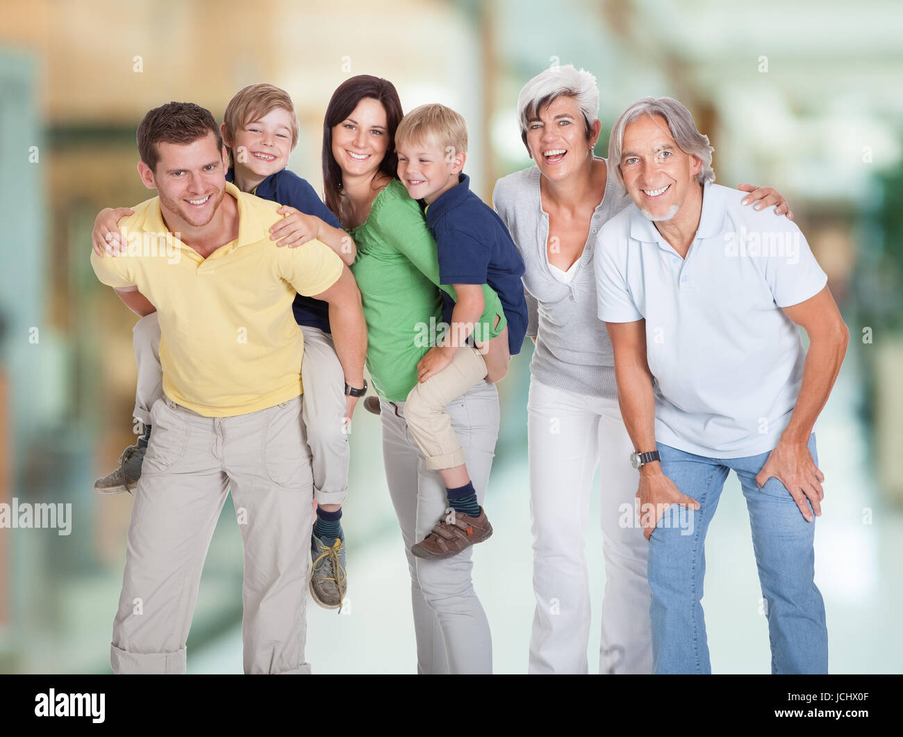 Portrait Of Happy Three Generations Family Standing Together Stock ...