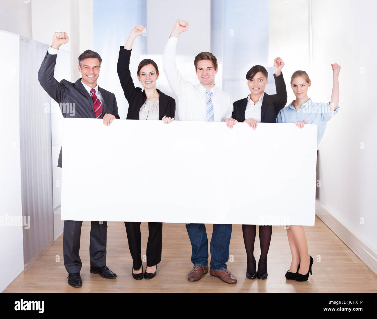 Excited Businessman Holding Black Placard With Hand Raised Stock Photo ...
