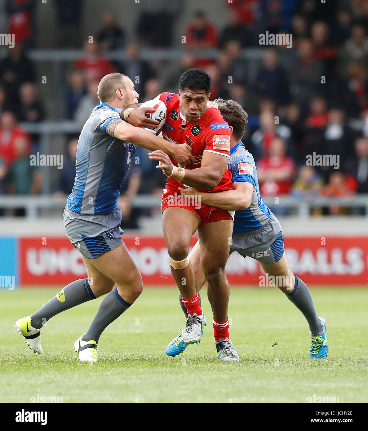 Salford Red Devils' Lama Tasi is tackled by Wakefield Trinity's Dean ...