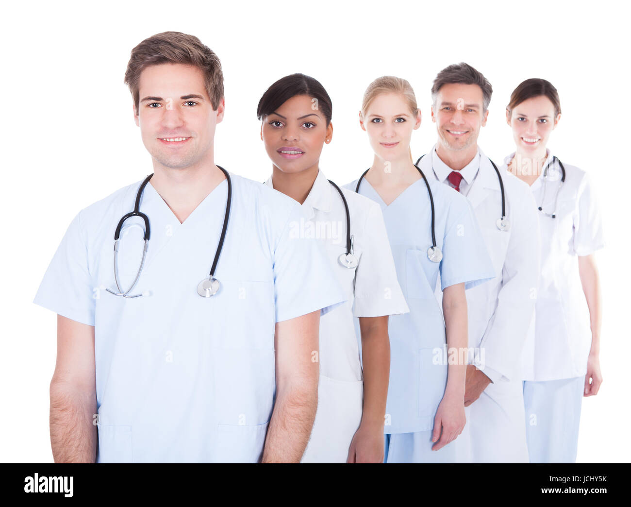 Happy Group Of Doctors And Nurses Standing In A Row Over White ...