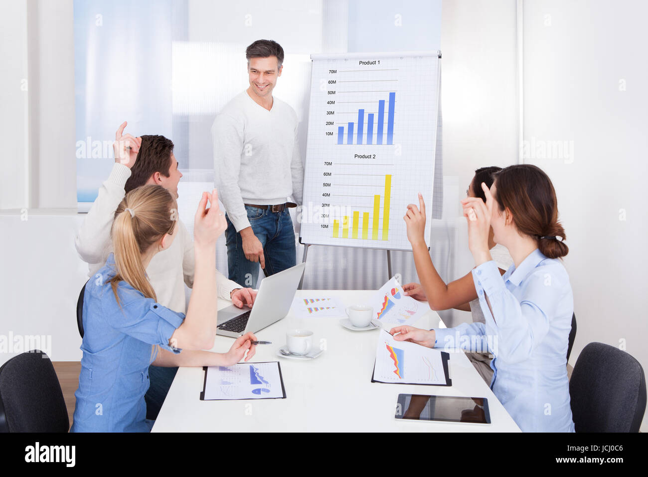 Business Coworkers Raising Hand For Asking Queries To Team Leader Stock ...