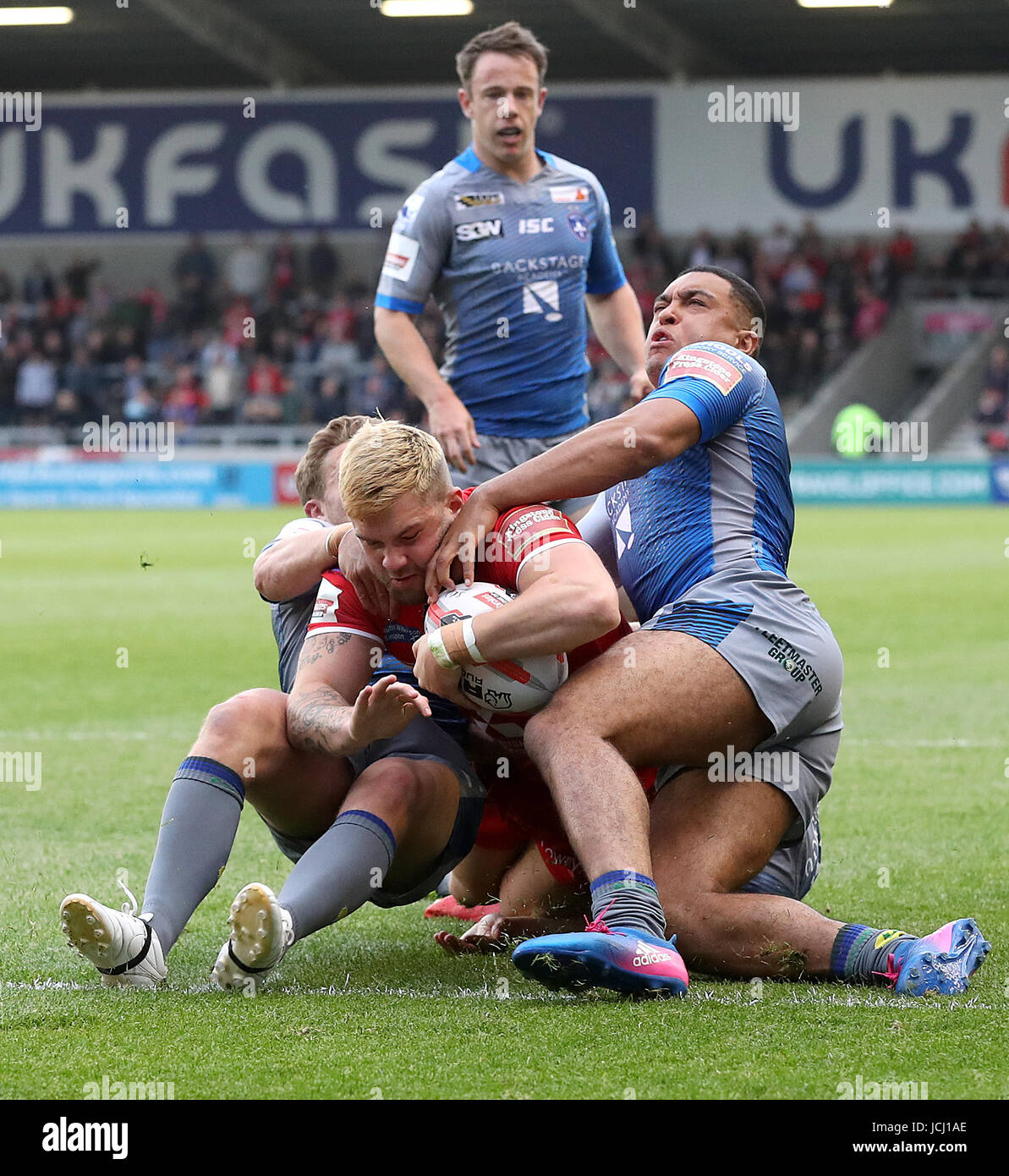 Salford Red Devils' Ryan Lannon is tackled by Wakefield Trinity's Kyle ...