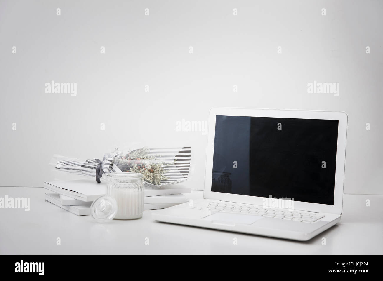 Stacked books and candle hi-res stock photography and images - Alamy