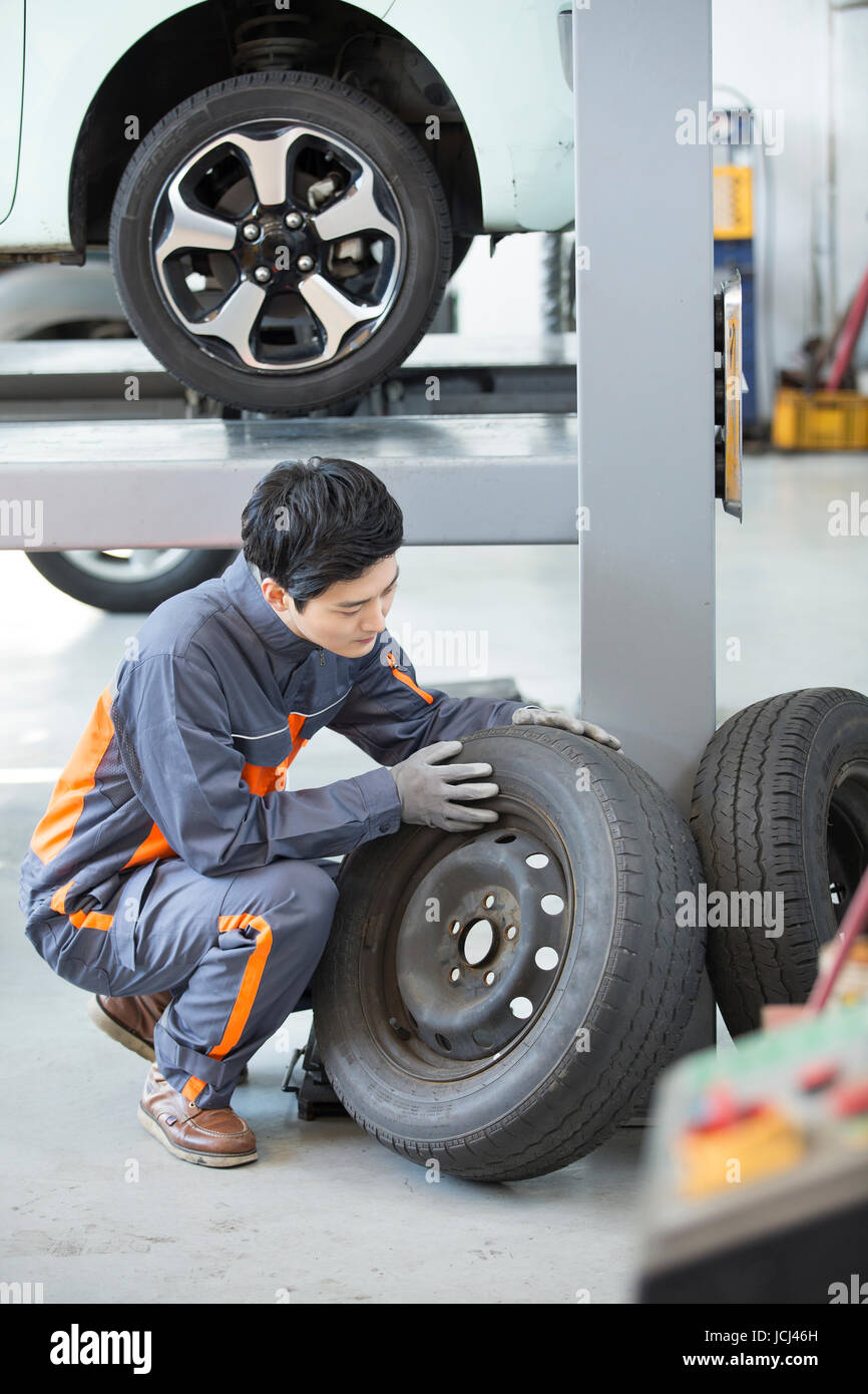 Sitting holding hi-res stock photography and images - Alamy