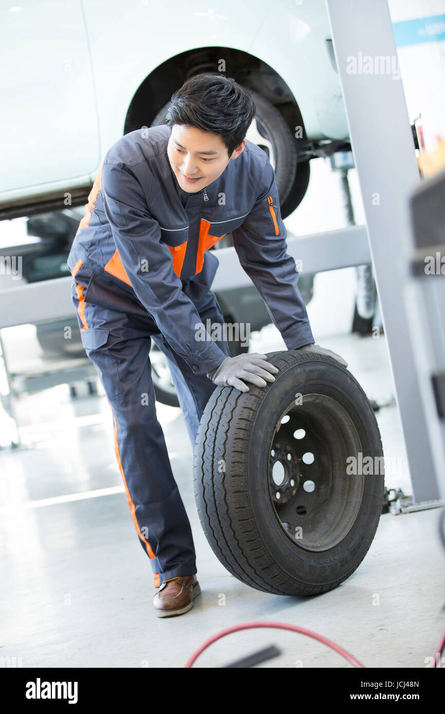 Holding tire hi-res stock photography and images - Alamy