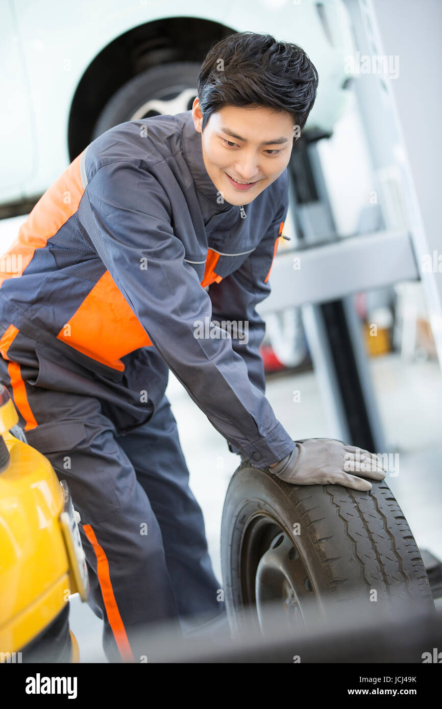 Holding tire hi-res stock photography and images - Alamy