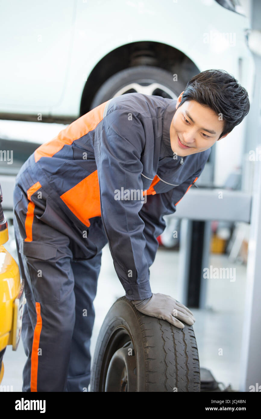Holding tire hi-res stock photography and images - Alamy