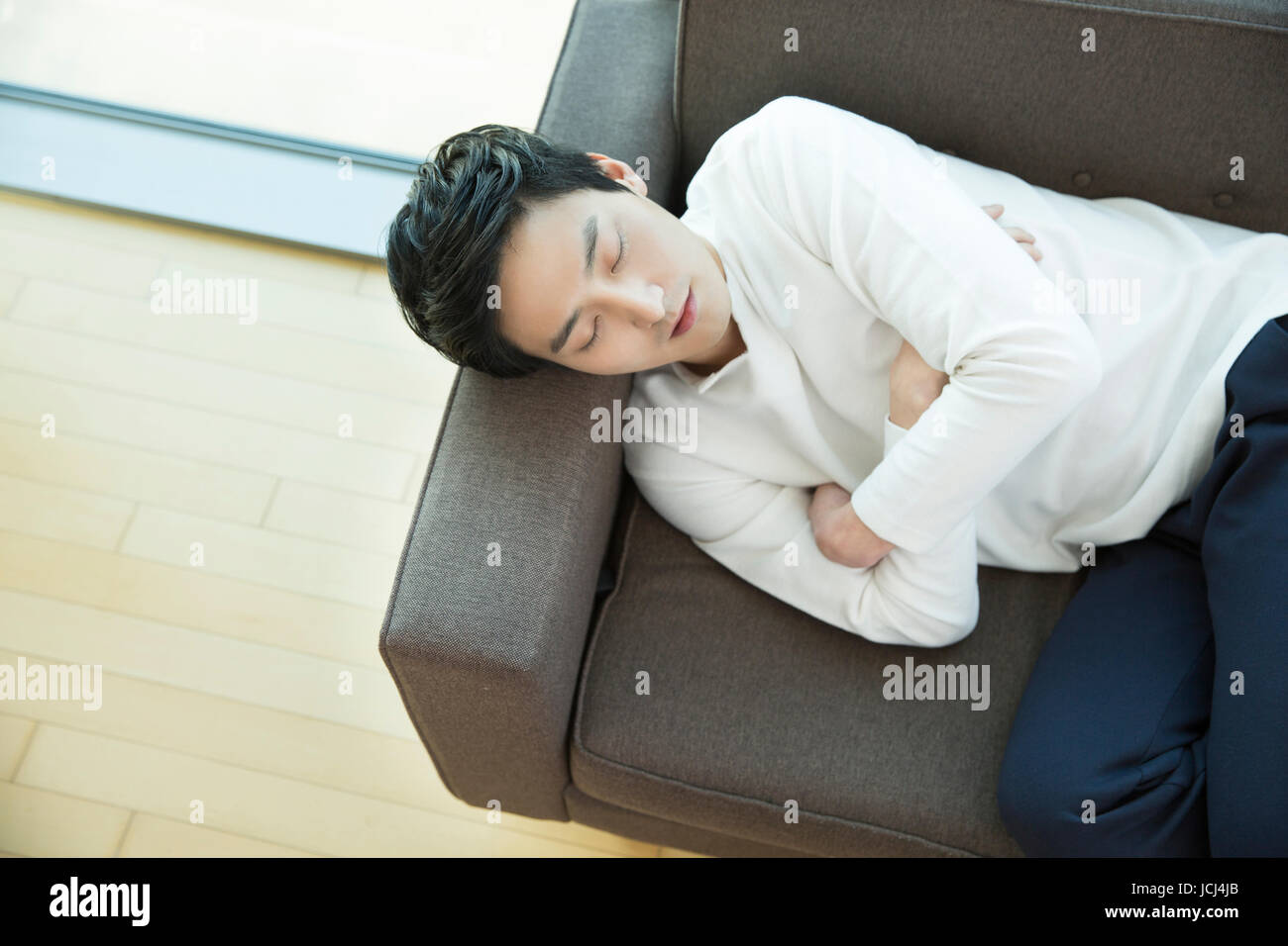 Three young men sleep on hi-res stock photography and images - Alamy
