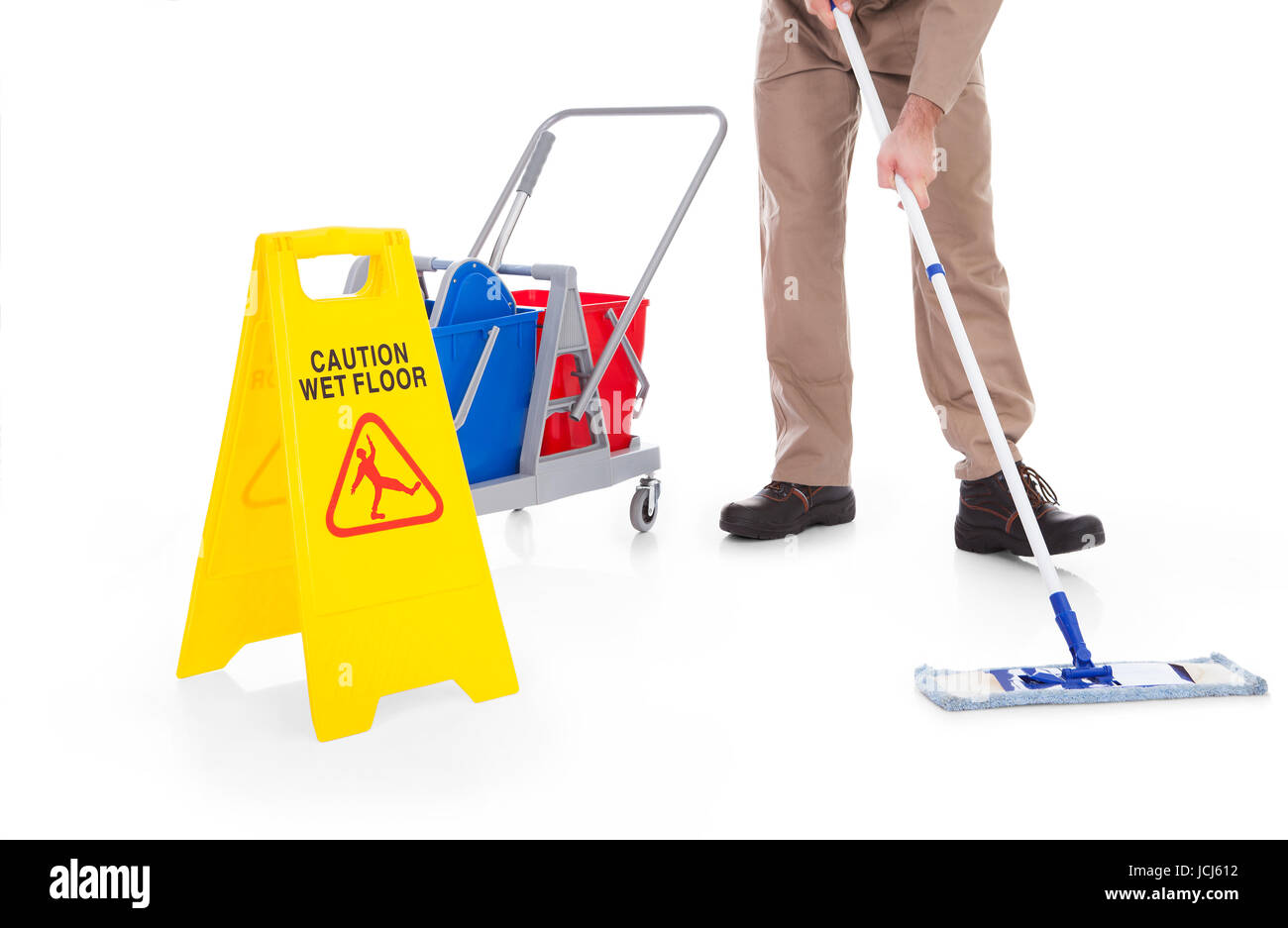 Close-up Of Male Sweeper Cleaning Floor On White Background With ...