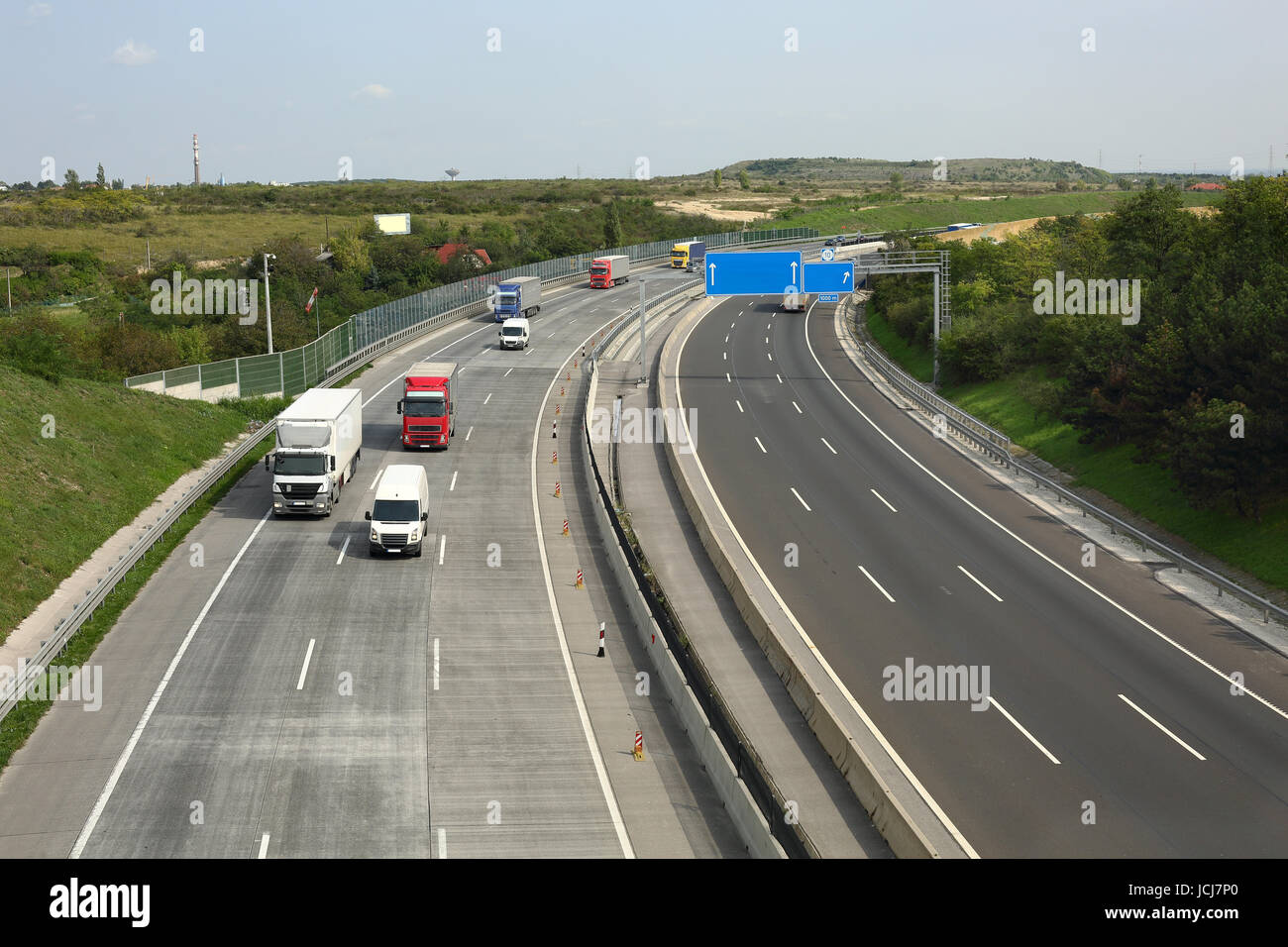 Highway with cars passing by Stock Photo - Alamy