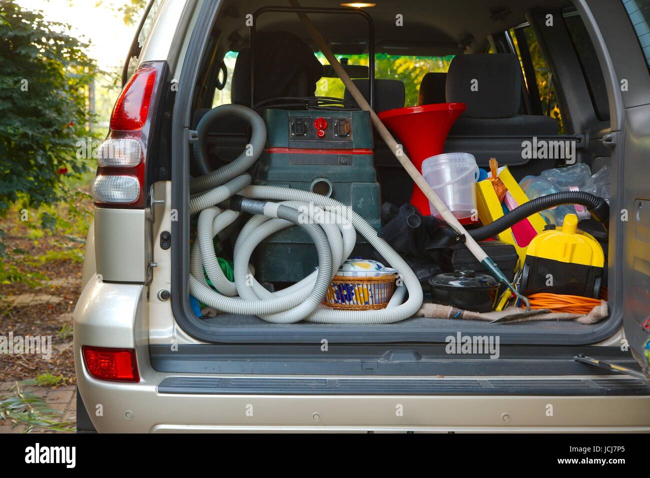 Trunk of a car loaded with equipment Stock Photo - Alamy