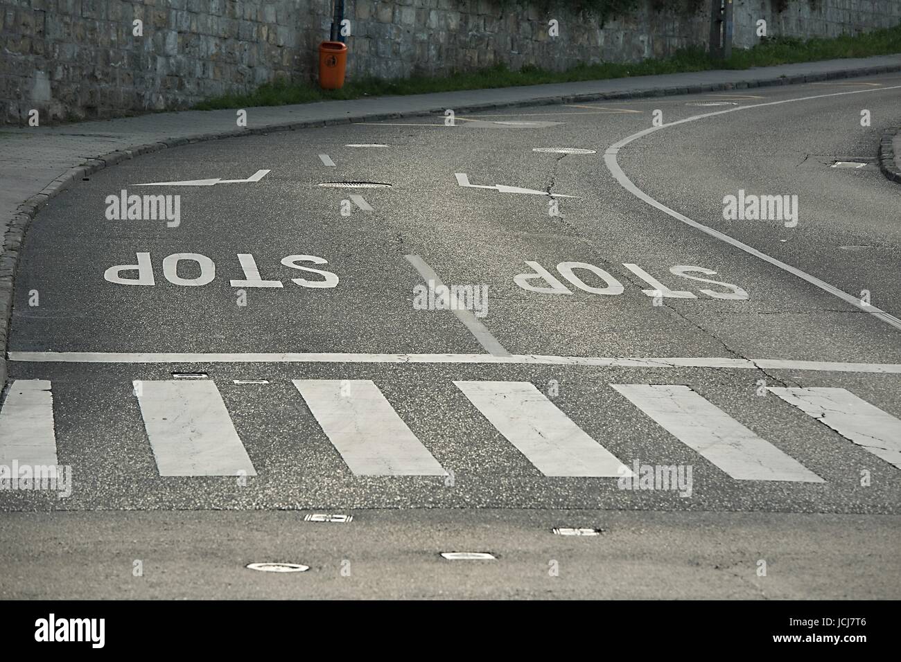 Stop sign painted on the road Stock Photo - Alamy