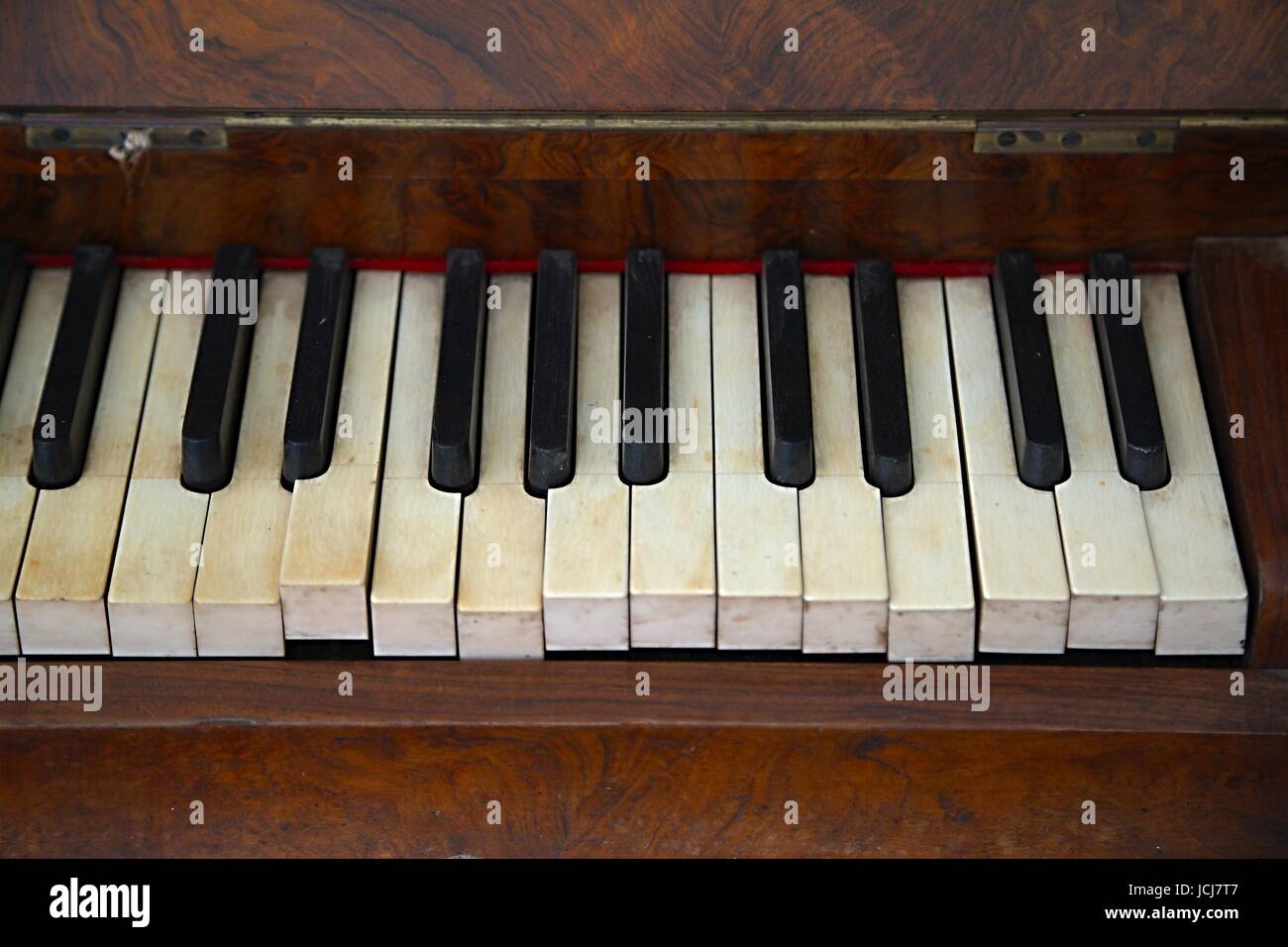 Old piano with faded keys Stock Photo - Alamy