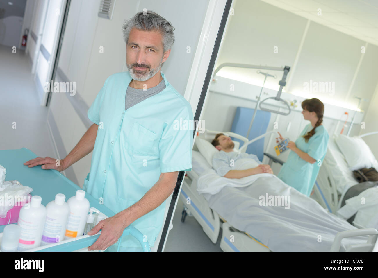 male nurse at work in hospital Stock Photo - Alamy