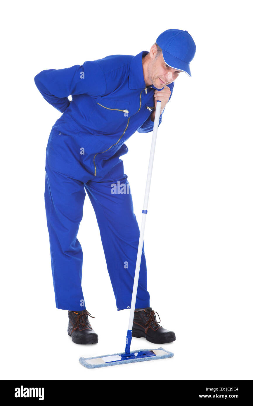 Portrait Of Male Cleaner In Uniform Suffering From Back Pain Stock ...