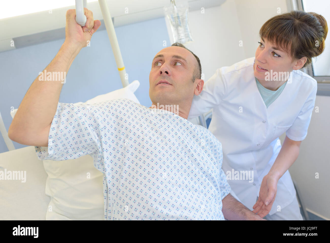 nurse taking care of suffering patient at the hospital Stock Photo - Alamy