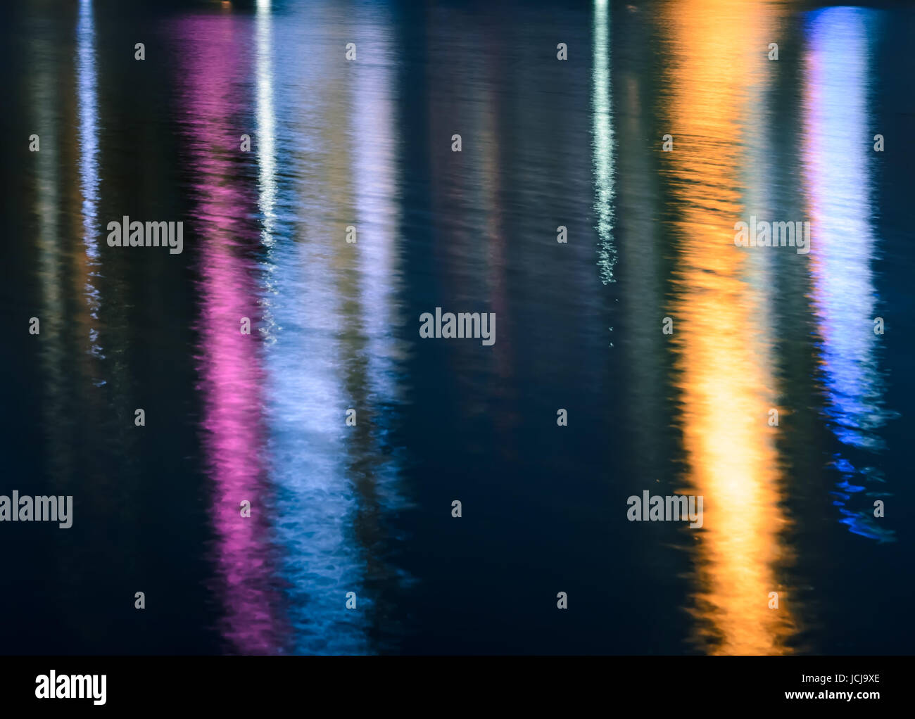 Colorful lights reflection on the water Stock Photo - Alamy