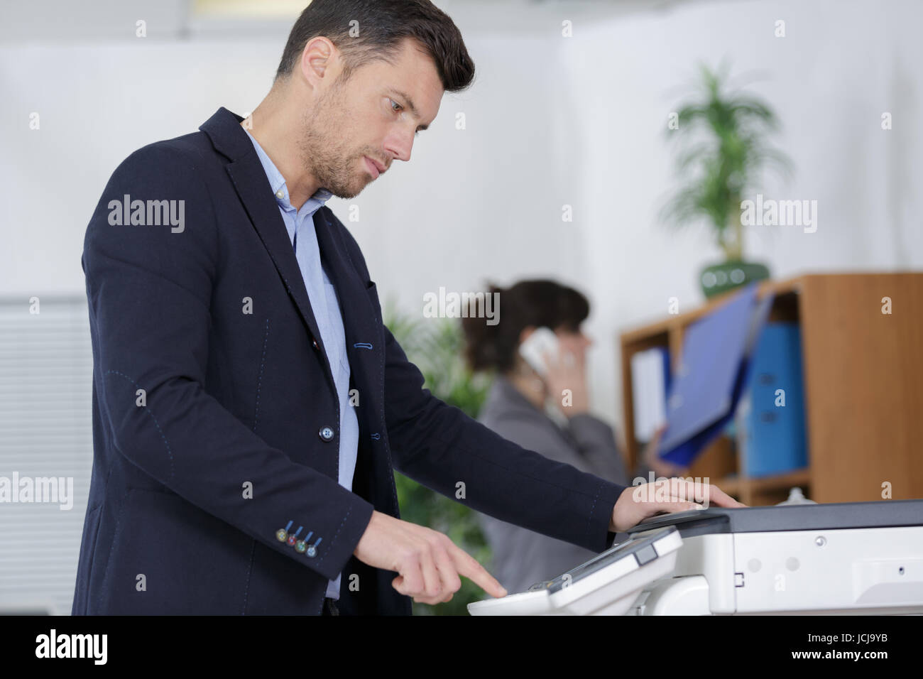businessman copy documents on copy machine Stock Photo - Alamy