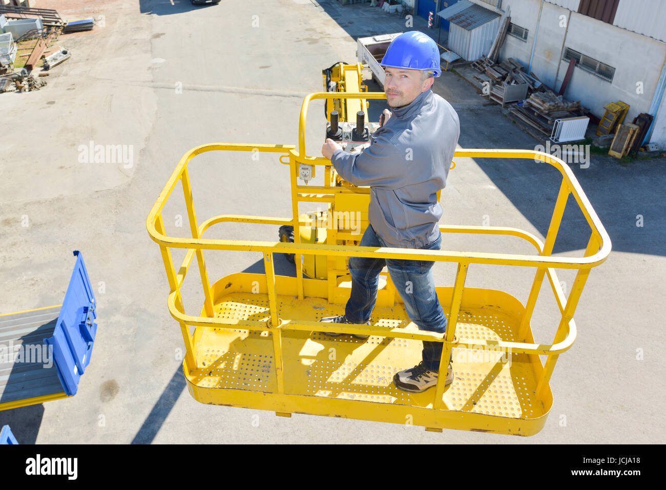 equipped man on a crane Stock Photo - Alamy