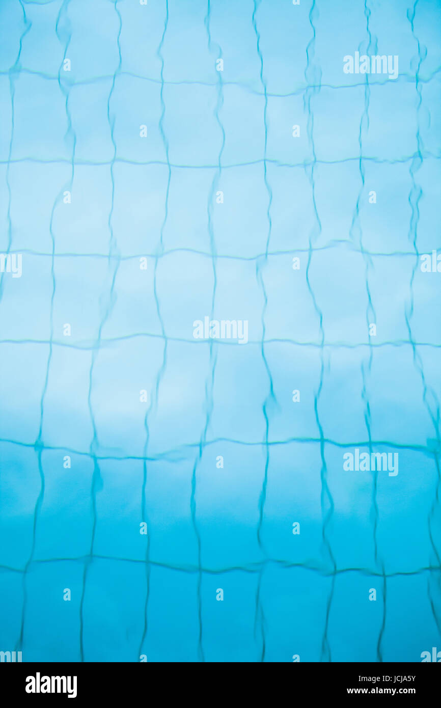 Tiles on bottom of swimming pool distorted slightly by water for ...