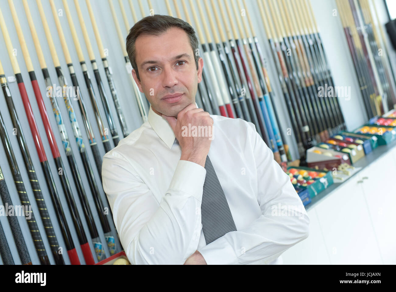 handsome pool store owner Stock Photo - Alamy