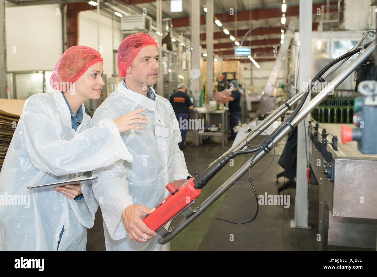 high tech factory workers talking at site Stock Photo - Alamy