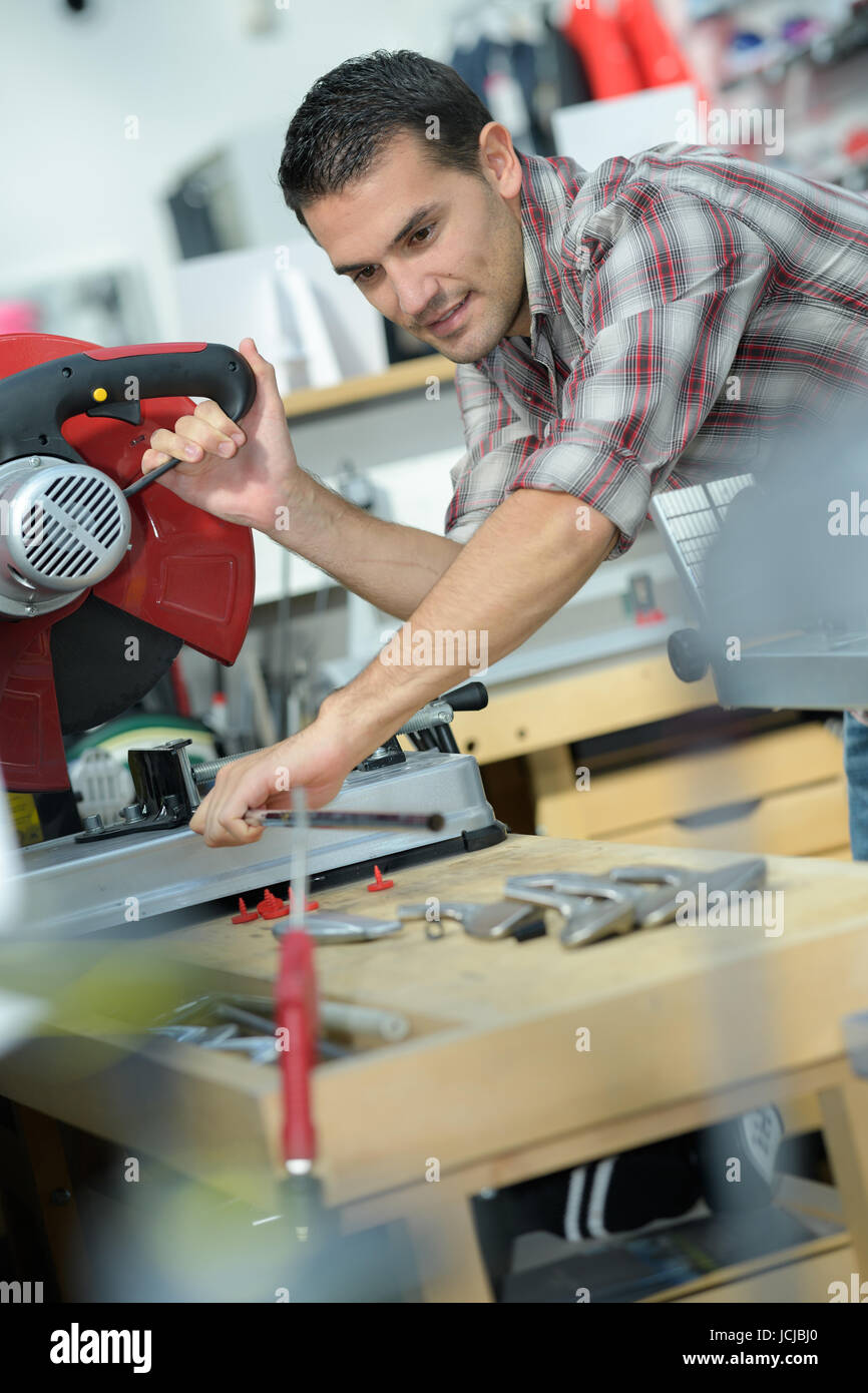 happy male carpenter working in carpentry shop Stock Photo - Alamy