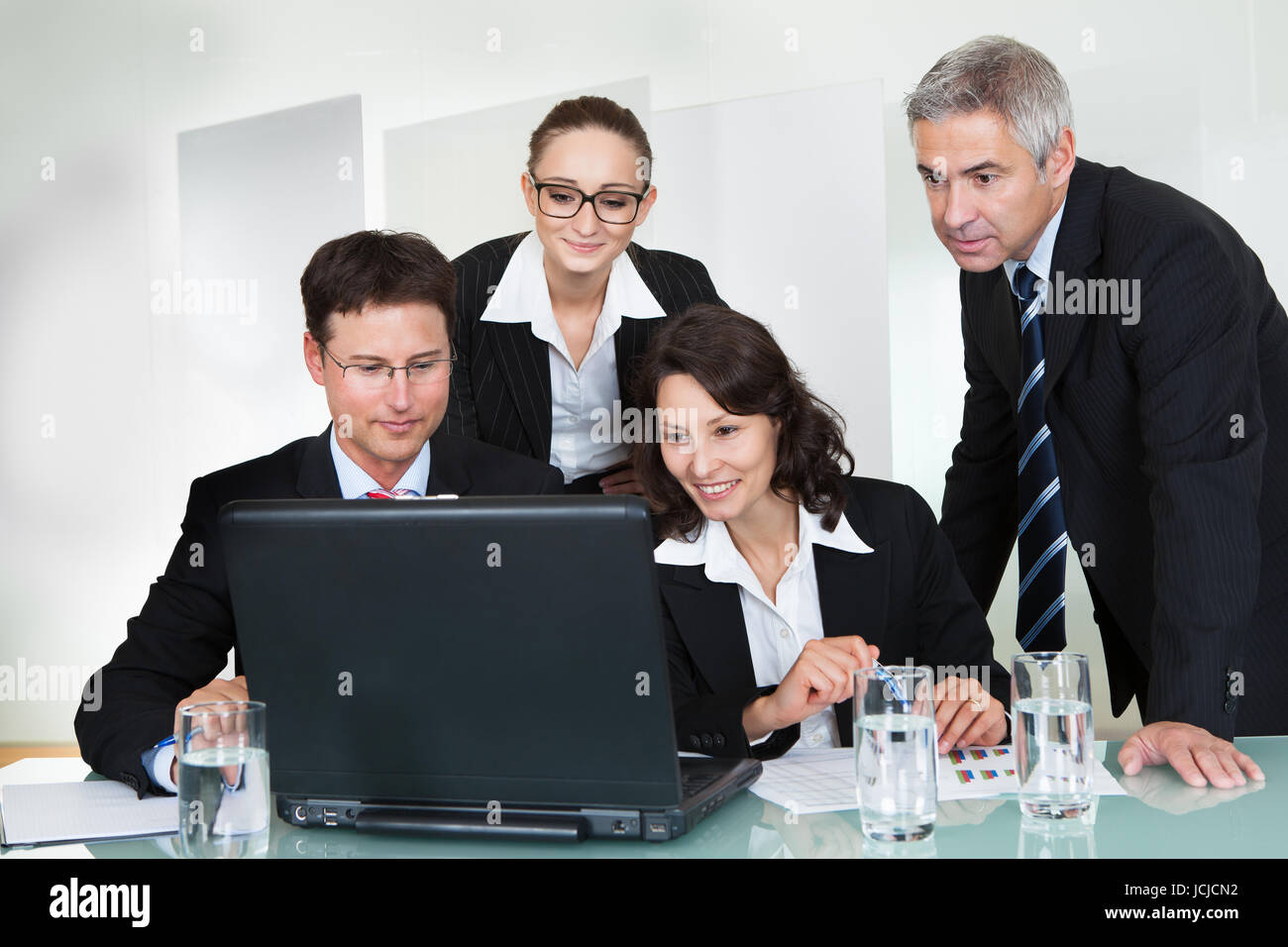 Confident successful business team of diverse executives posing in an ...