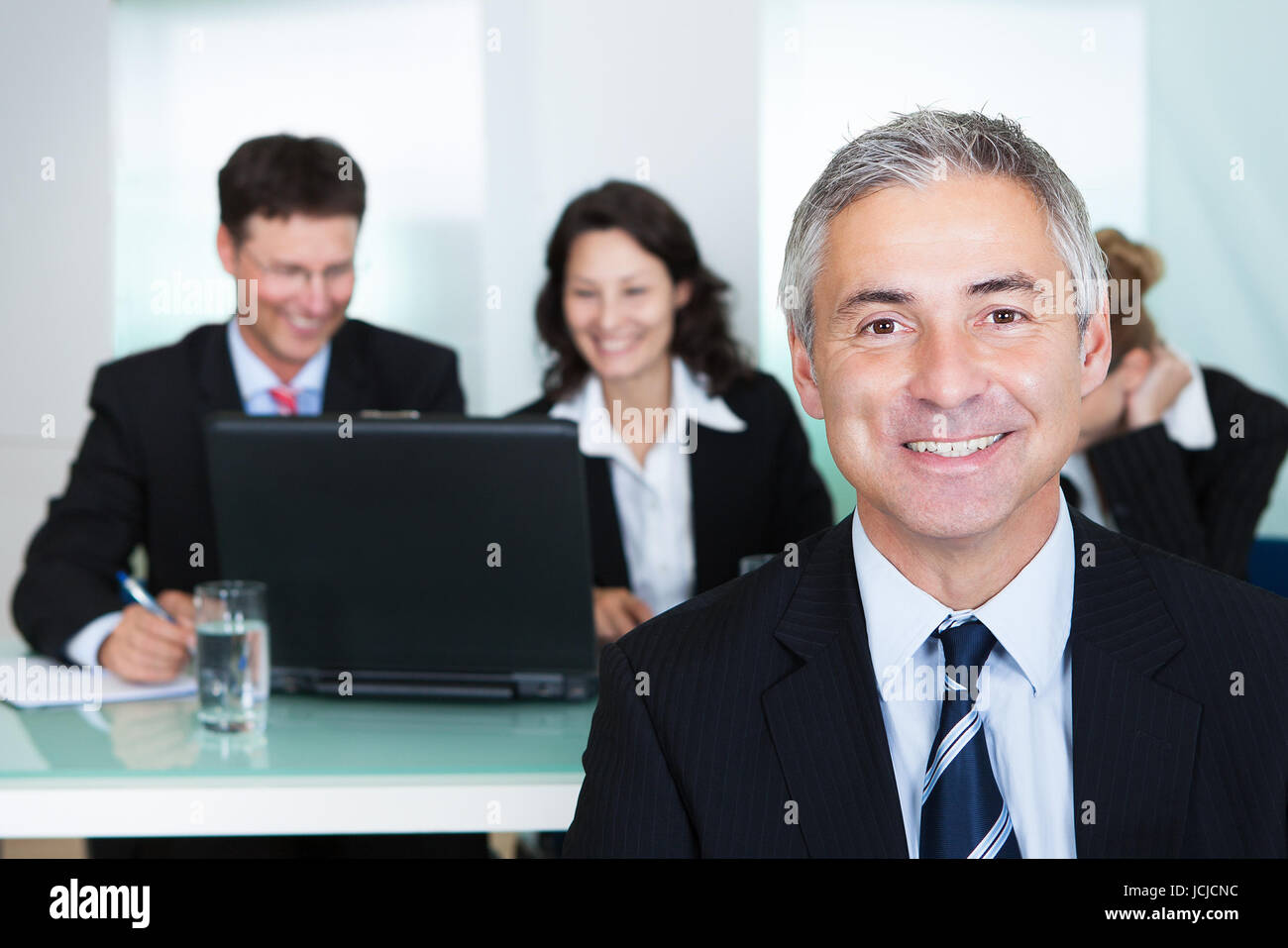 Corporate promotion and leadership concept with a successful handsome ...