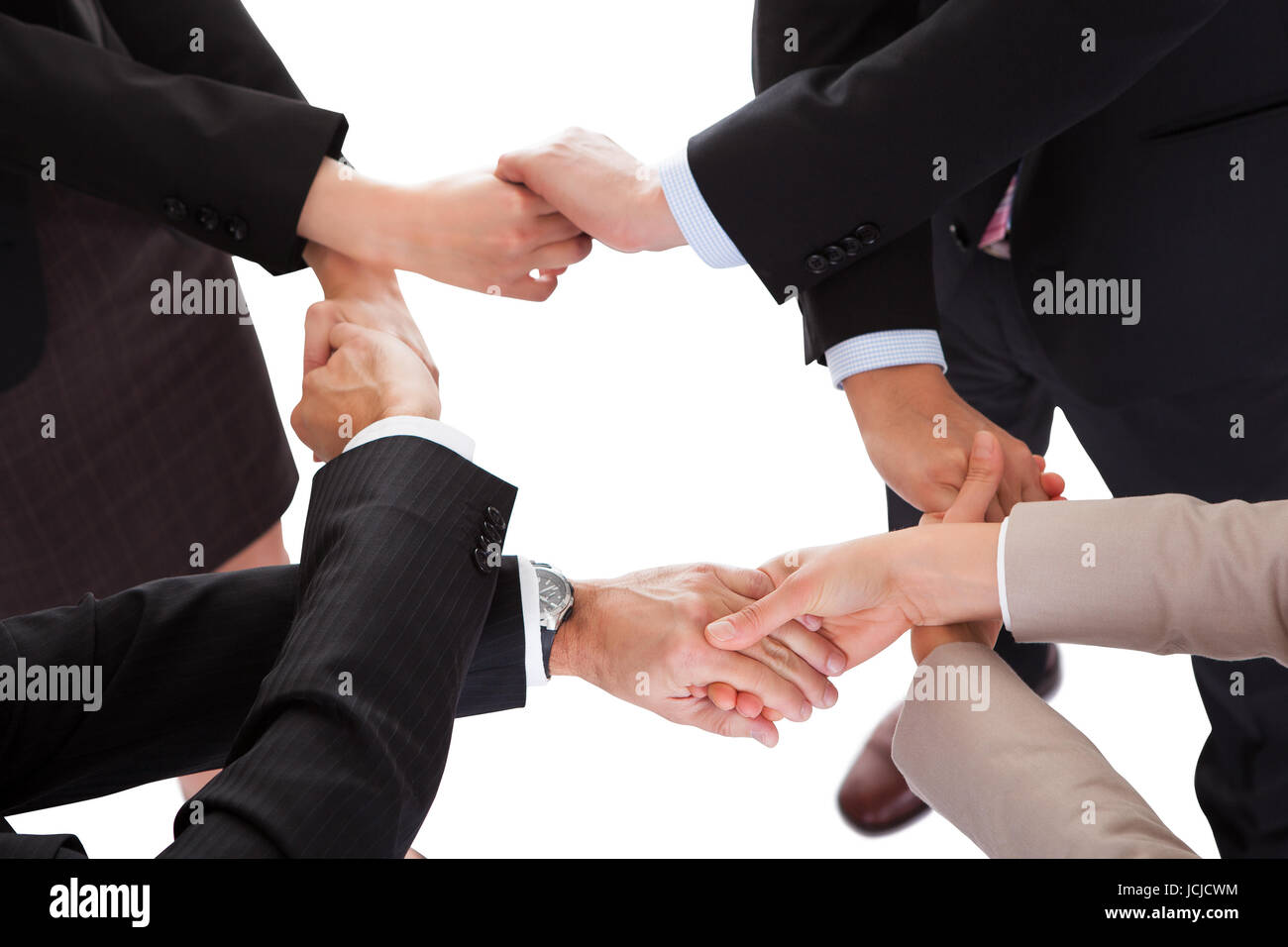 Diverse team linking arms hi-res stock photography and images - Alamy