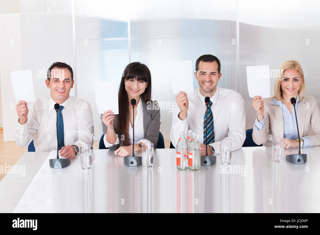 Group Of Business People In Holding Voting Paper Stock Photo - Alamy