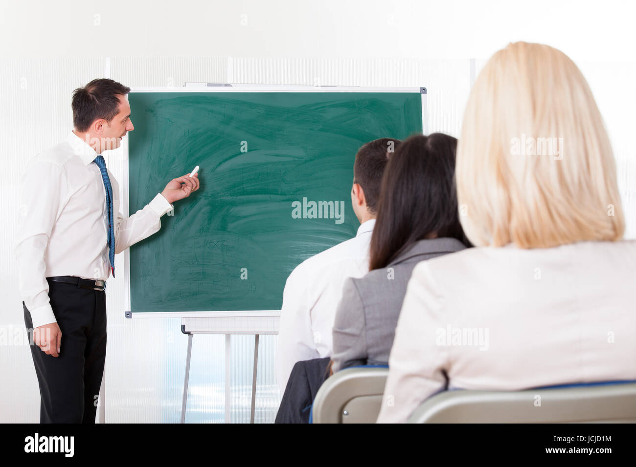 Blonde businessman writing on hi-res stock photography and images - Alamy