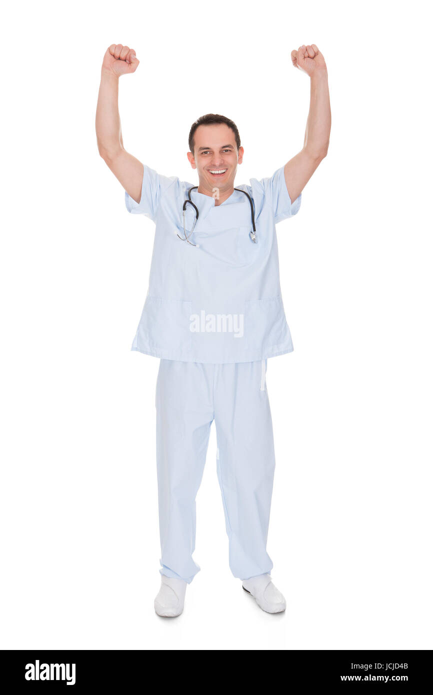 Happy Male Doctor With Arm Raised Over White Background Stock Photo - Alamy