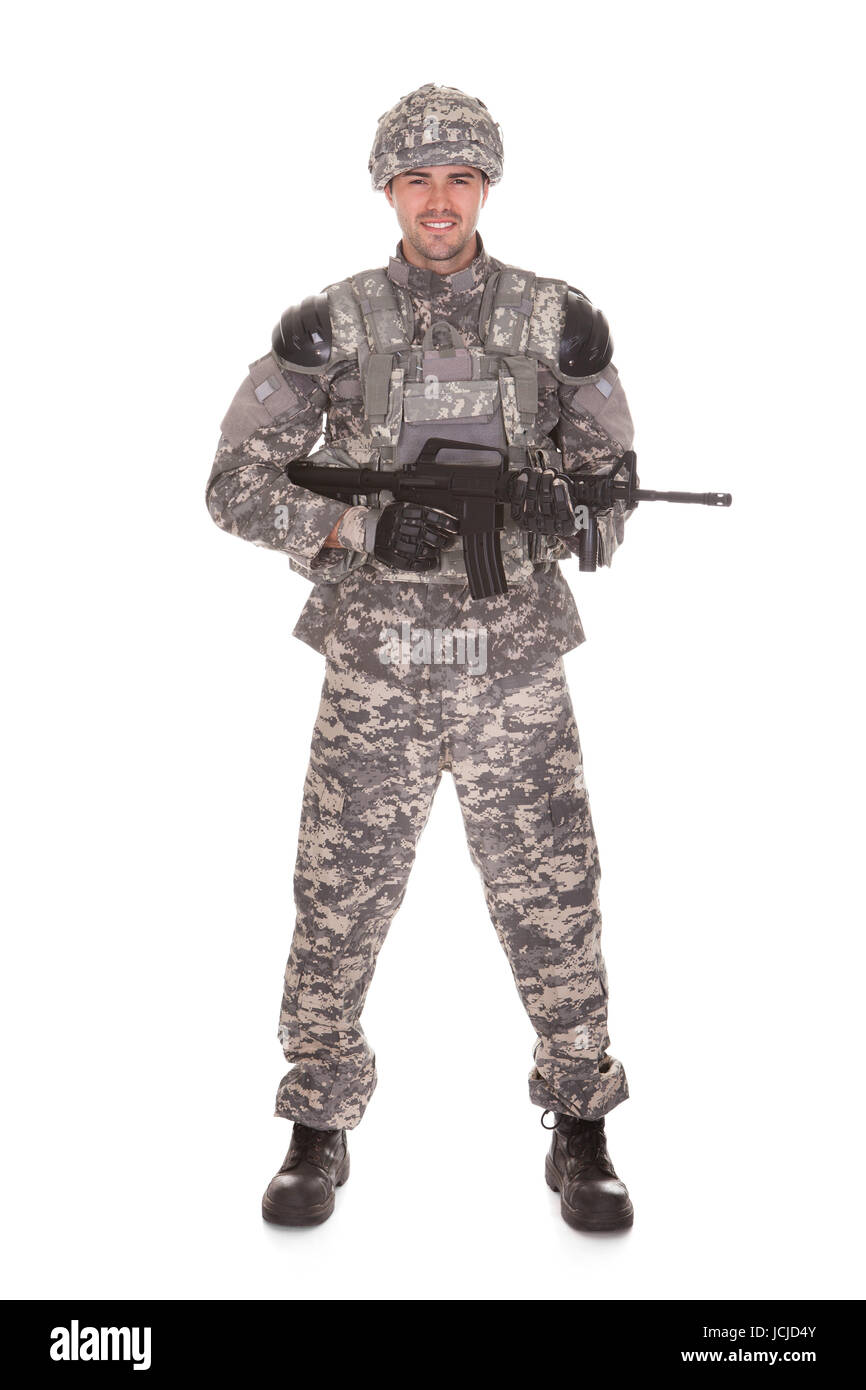 Soldier Holding Rifle Isolated Over White Background Stock Photo - Alamy